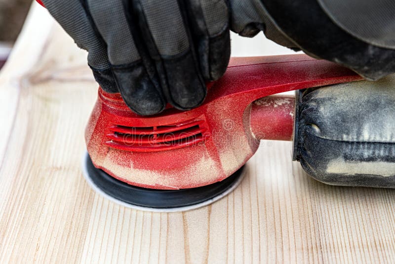 Man is Sanding with an Disk Type Sander or Orbital Sander a Wooden ...