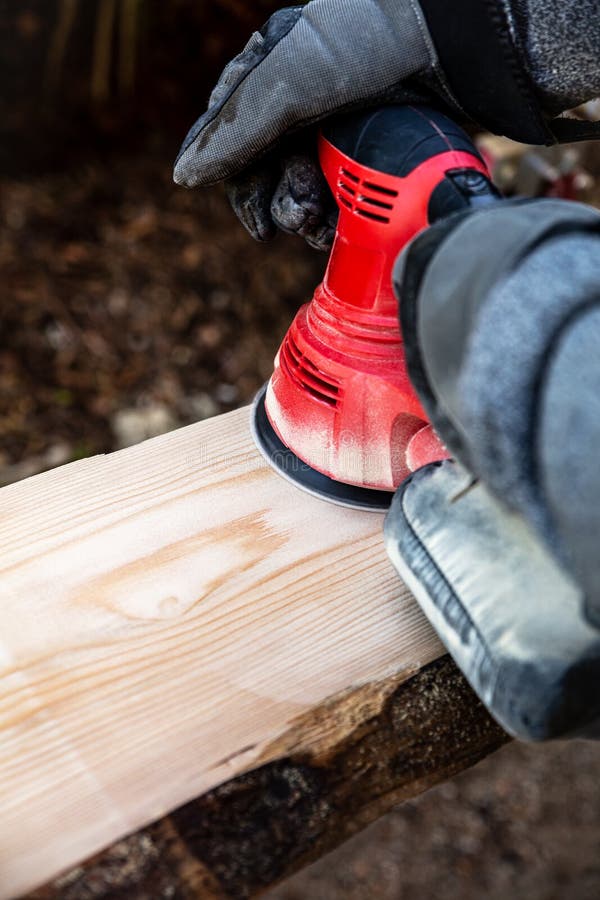 Man is Sanding with an Disk Type Sander or Orbital Sander a Wooden ...