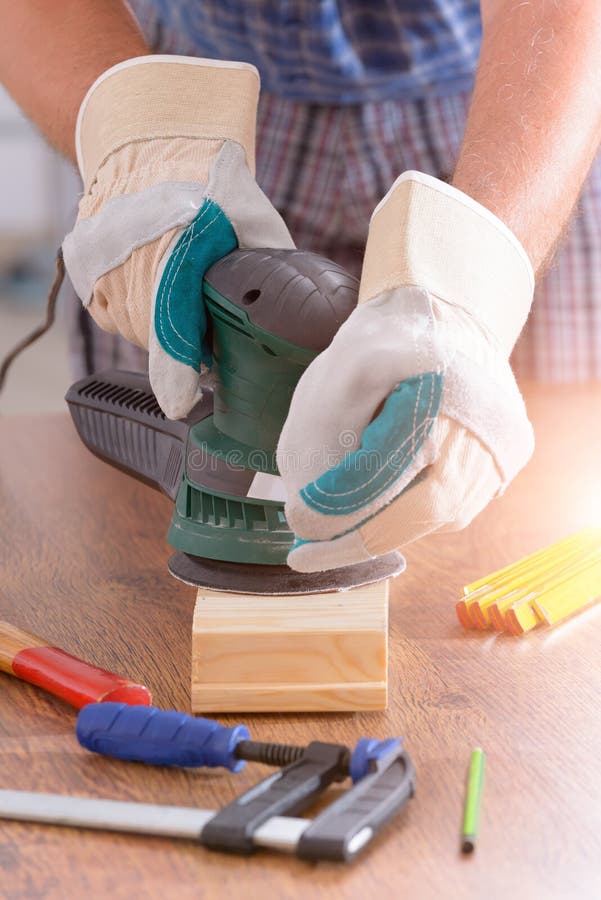 Man Sanding a Wood with Orbital Sander Stock Photo - Image of equipment ...