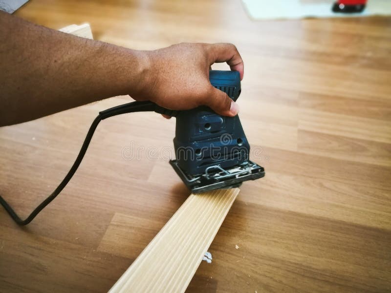 Man Sanding Wood with Square Sander in a Workshop. Stock Photo - Image ...