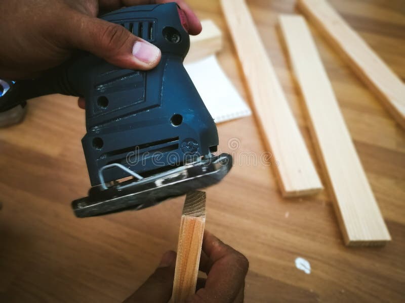 Man Sanding Wood with Square Sander in a Workshop. Stock Photo - Image ...