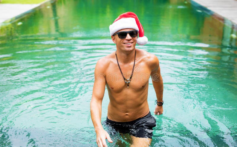 Man with Santa Hat in the Pool Stock Photo - Image of happy, outdoor ...