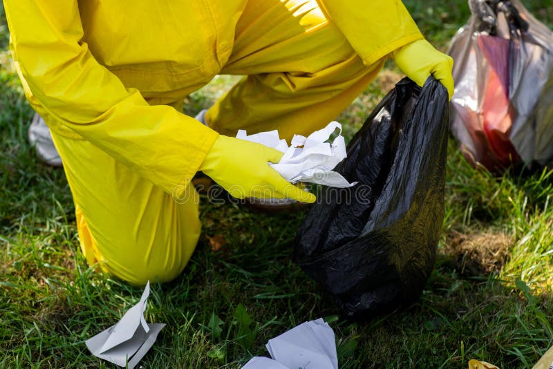 The Man Sat Down and Collected the Garbage in a Trash Bag. a Man in a ...