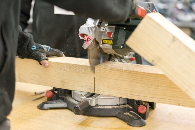 Man Carpenter Cutting Wood Using Table Saw at Construction Site Stock ...