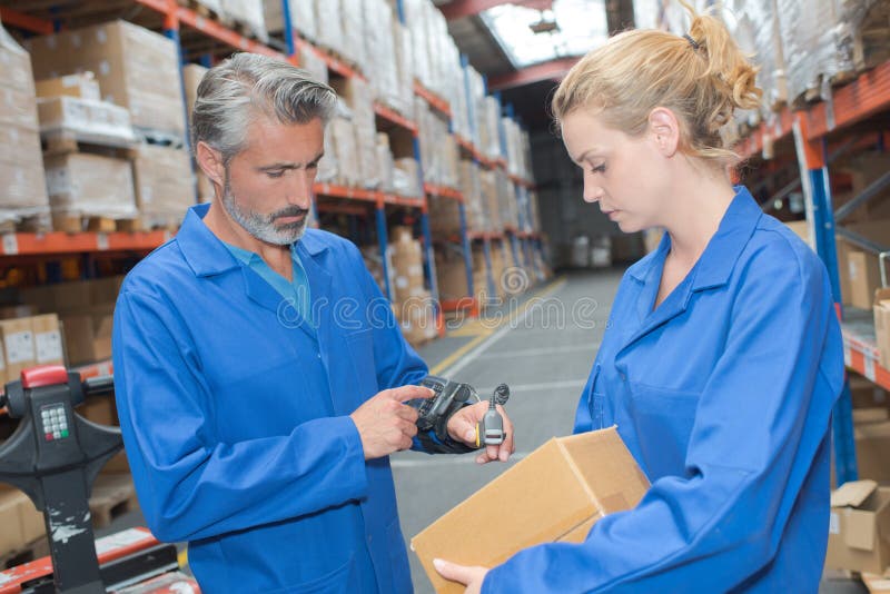 Man Scanning Box with Computerized Scanner Stock Photo - Image of ...