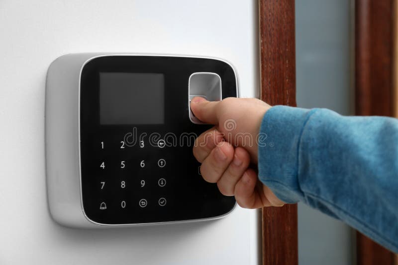 Man Scanning Fingerprint on Alarm System Indoors Stock Image - Image of ...