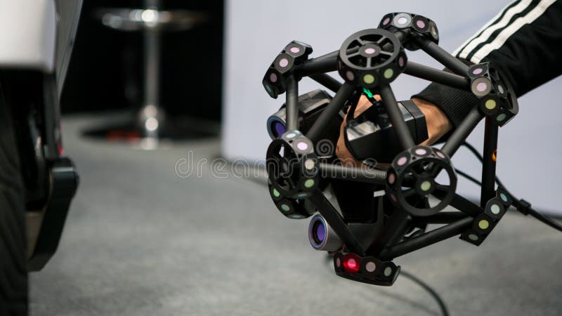 Man Scanning a Motorcycle Using a Measuring Machine 3D Scan High ...