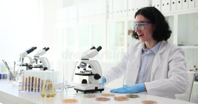 Man Scientist Makes Discovery Looking through Microscope Stock Footage ...