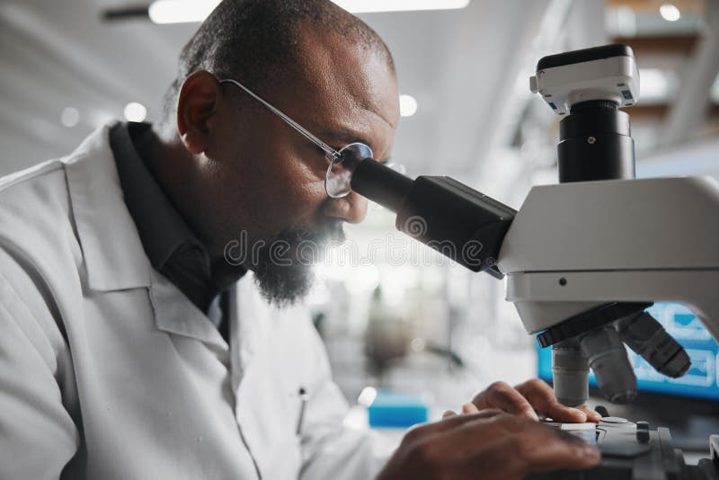 Man, Scientist and Research with Microscope in Laboratory for ...