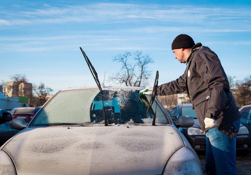 Man Scraping Front Windshield Stock Photo - Image of window, outdoor ...