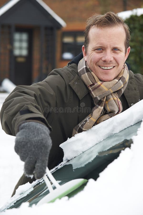 Man Scraping Snow from Car Windscreen Stock Photo - Image of outdoors ...