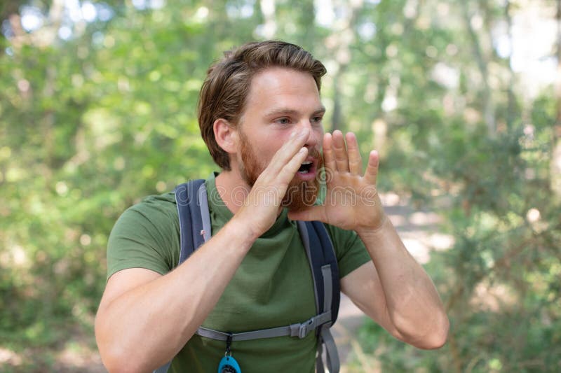 Man Screaming in Forest Calling Somebody Stock Photo - Image of ...