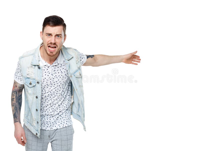 The Man Screams. Aggressive Guy in Tattoos Yelling at the Frame and ...