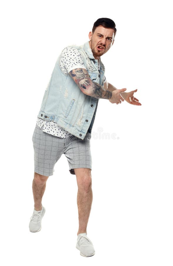 The Man Screams. Aggressive Guy in Tattoos Yelling at the Frame and ...