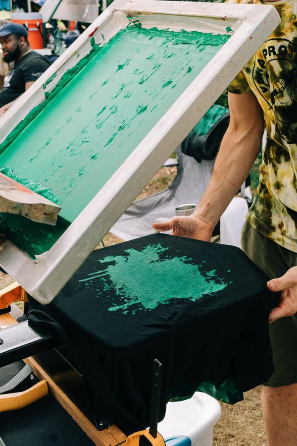 Man screen printing stock image. Image of outdoor, screenshot - 399390023