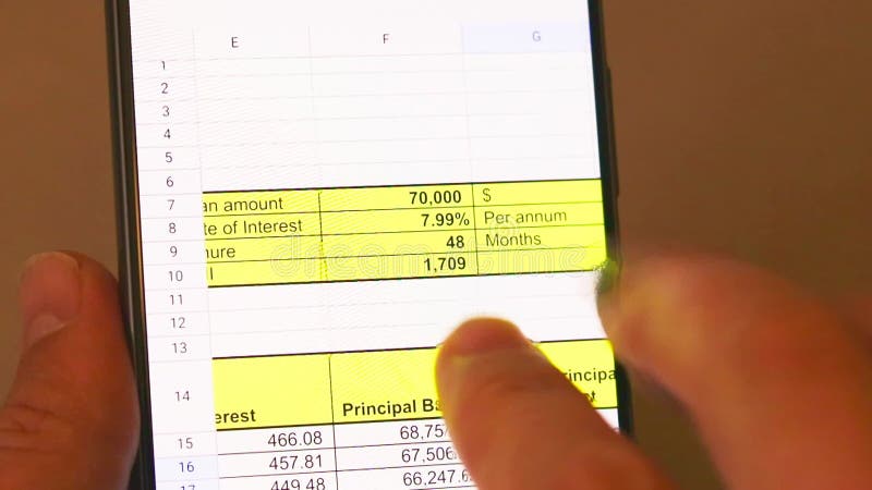 Man Scrolling an Excel Sheet on the Phone Screen Showing Bank Loan ...