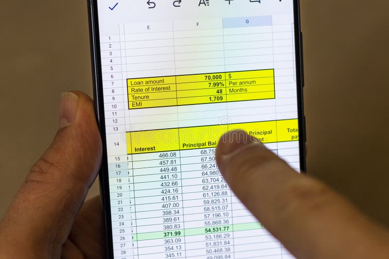 Man Scrolling an Excel Sheet on the Phone Screen Showing Bank Loan ...