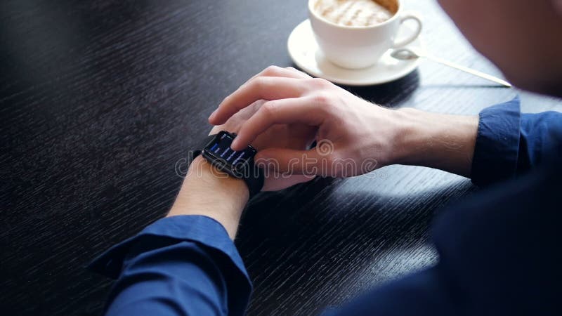 Man Scrolling the Information on the Smartwatch`s Screen. Close-up ...