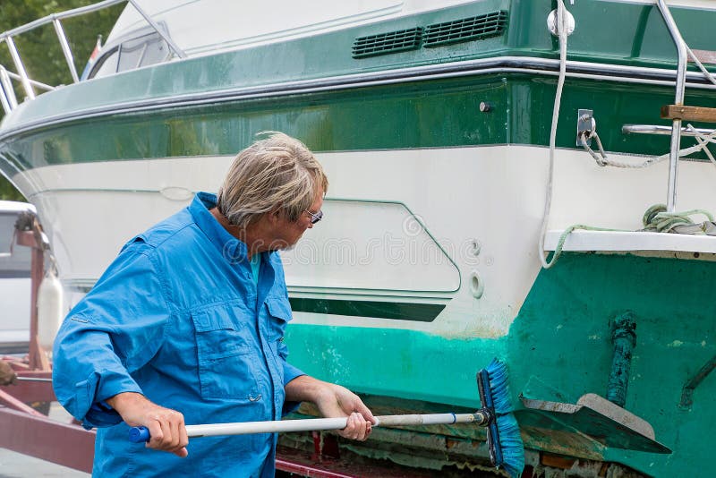 Caucasian Man Cleaning Boat Hull Stock Image - Image of suit, nautical ...