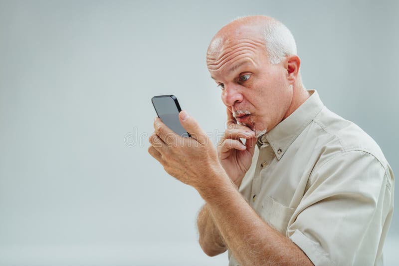 Thoughtful Elder Reflects on Smartphone S Intricate Message Stock Photo ...