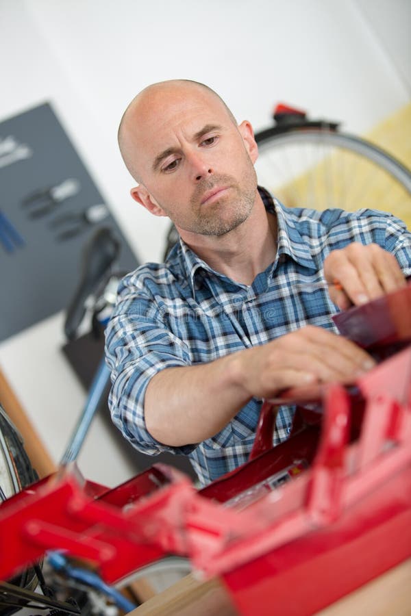 Man searching in tool box stock image. Image of person - 99327931