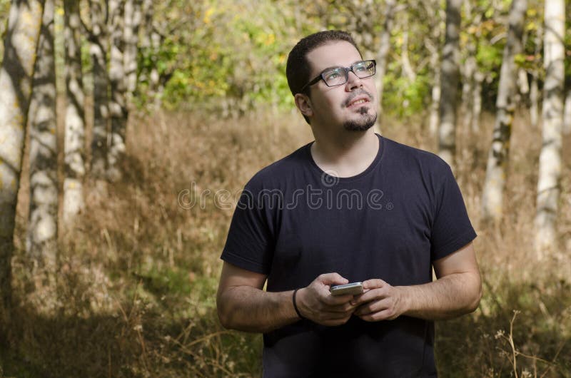 Man Searching Telephone Coverage in the Forest Stock Photo - Image of ...