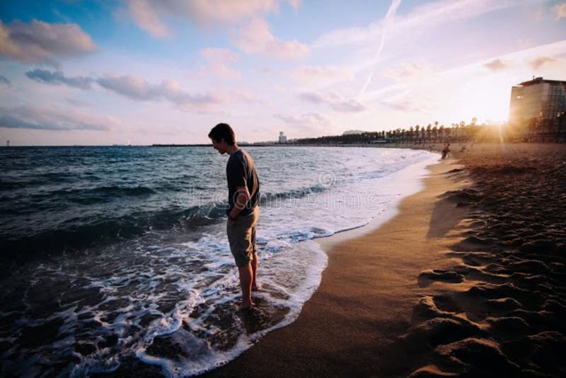 Man at the seashore stock image. Image of wave, sand - 83078263