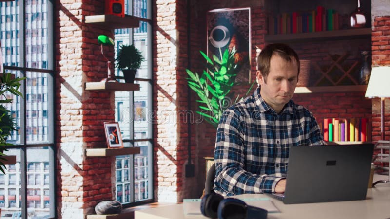 Man Seated at Home Office Desk Using Laptop, Checking Emails Stock ...