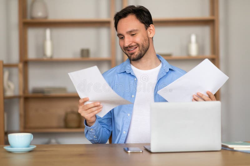 Man Sitting at Table with Papers, Working from Home Stock Image - Image ...