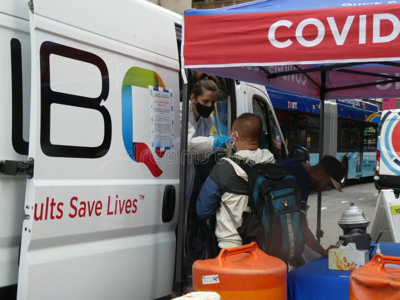 A Man is Seen Having a COVID Test Performed at a Mobile Testing Station ...