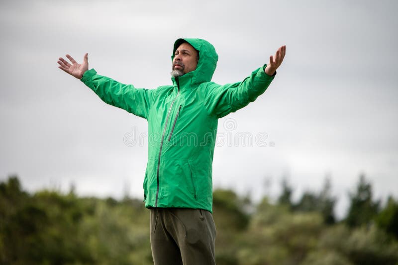 Portrait of Man with Hands Stretched Out Stock Image - Image of field ...