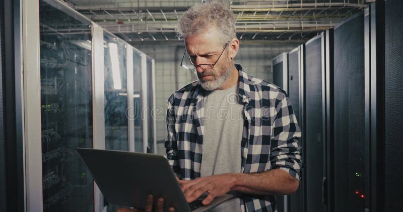Man Working on Laptop in Server Room Stock Video - Video of internet ...
