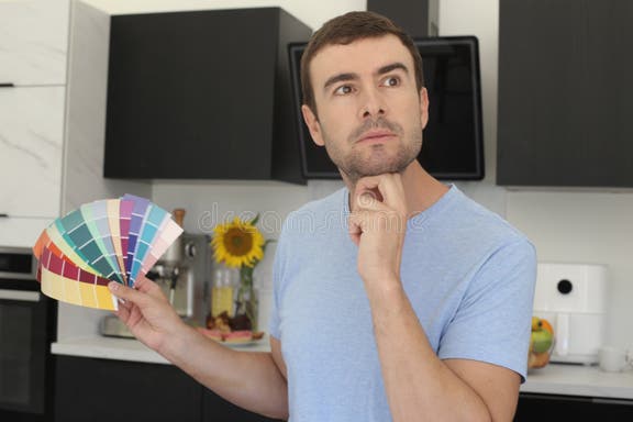 Man Selecting the Right Color for a Home Wall Stock Image - Image of ...