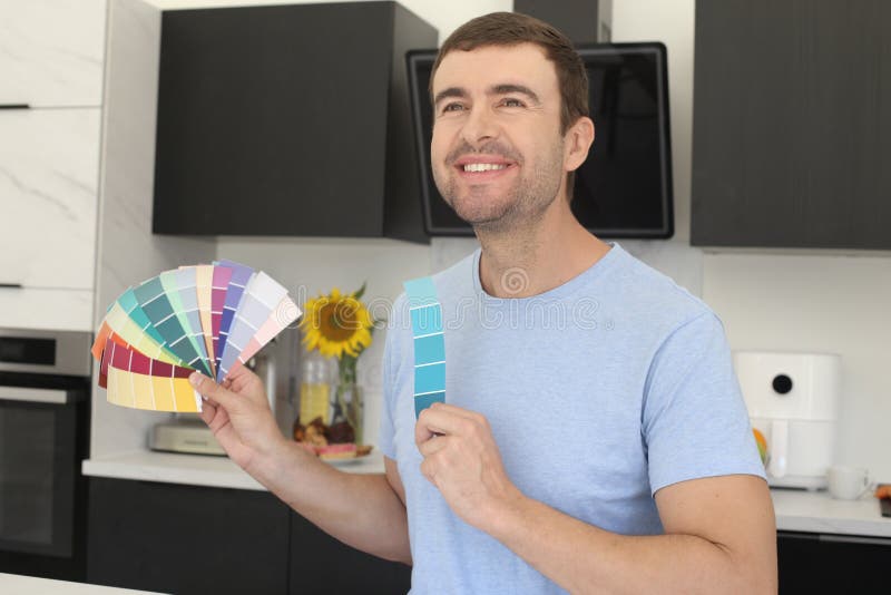 Man Selecting the Right Color for a Home Wall Stock Image - Image of ...