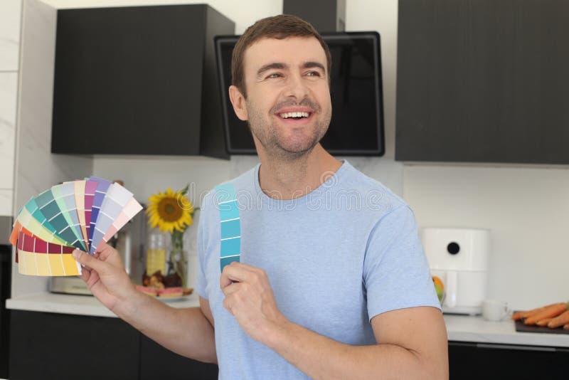 Man Selecting the Right Color for a Home Wall Stock Photo - Image of ...
