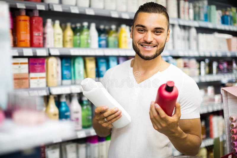 Man Selecting Shampoo in the Store Stock Photo - Image of acquire ...