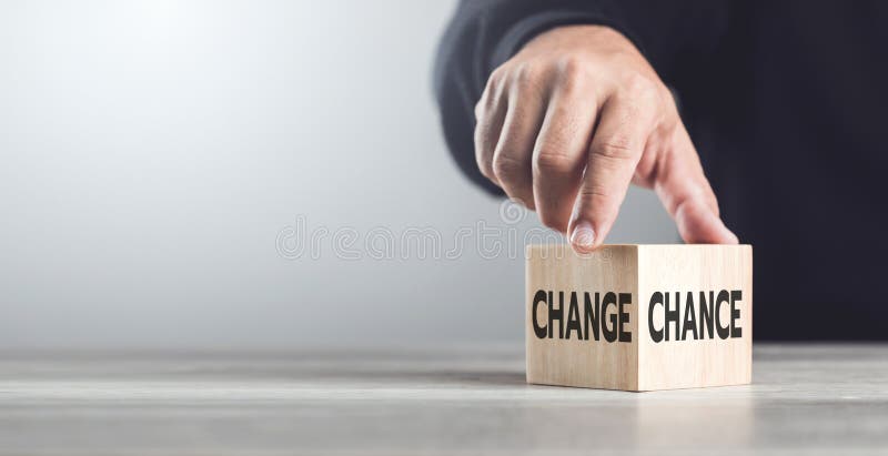 Man Selects between the Words CHANGE and CHANCE on Wooden Blocks, Stock ...