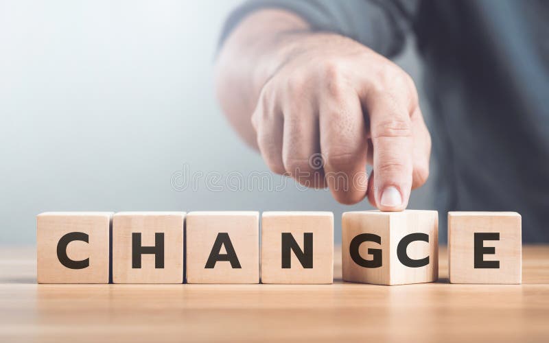 Man Selects between the Words CHANGE and CHANCE on Wooden Blocks, Stock ...