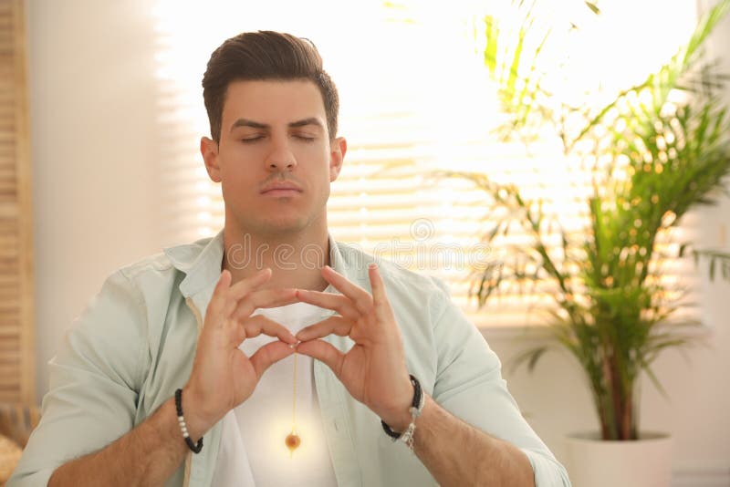Man during Self-healing Session in Room Stock Photo - Image of heart ...