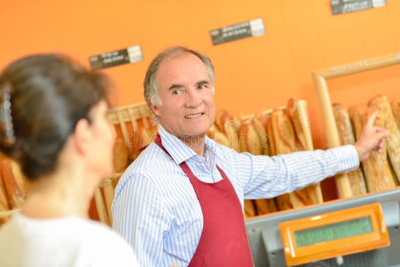 Man Selling Bread in Local Store Stock Image - Image of tray, brown ...