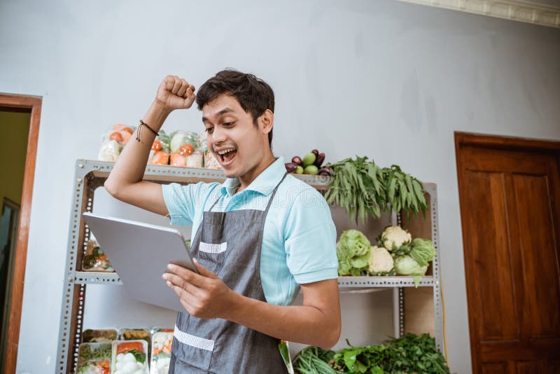 Man Selling Vegetables Counting Vegetables Using a Digital Tablet Stock ...