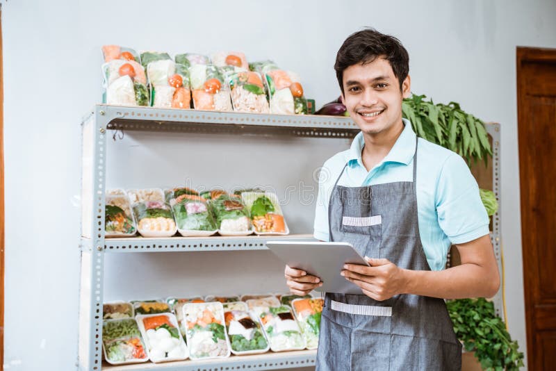 Man Selling Vegetables Counting Vegetables Using a Digital Tablet Stock ...
