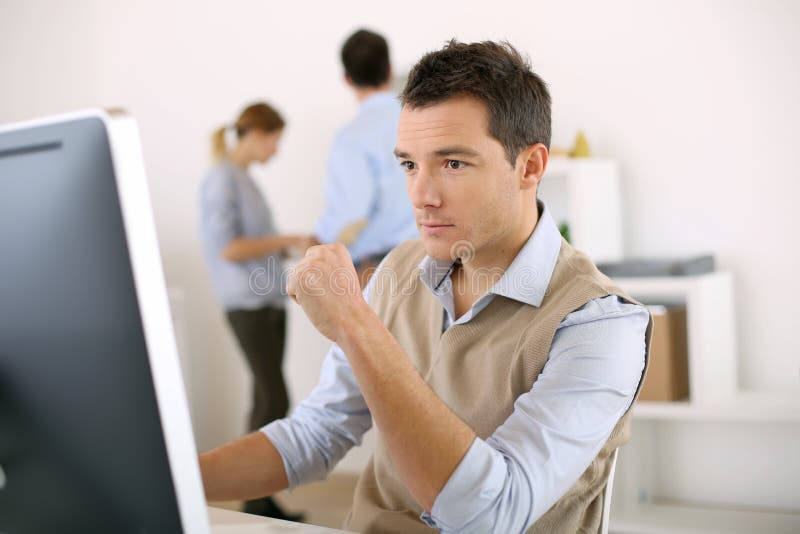 Man with a Serious Look Working in Office Stock Image - Image of ...