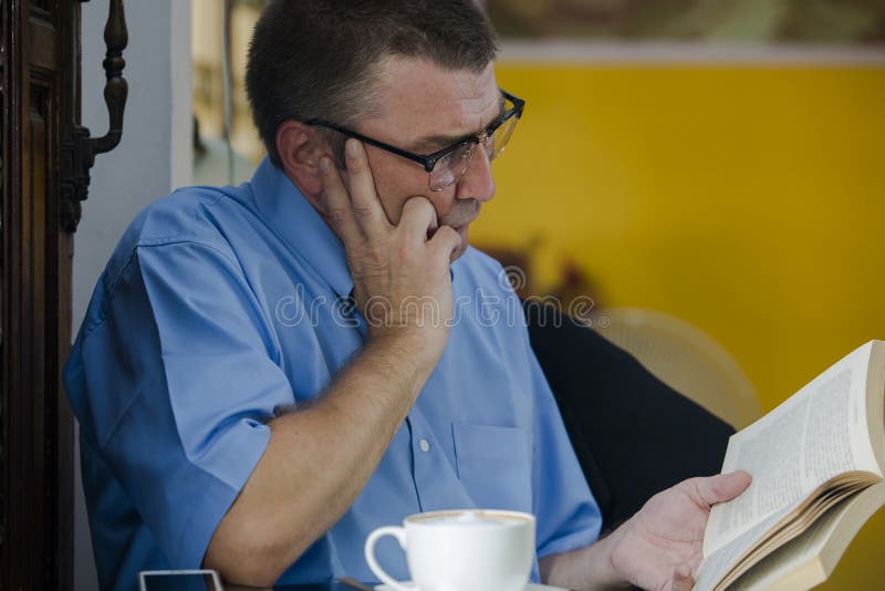 Man is reading a book stock photo. Image of suit, read - 52919718