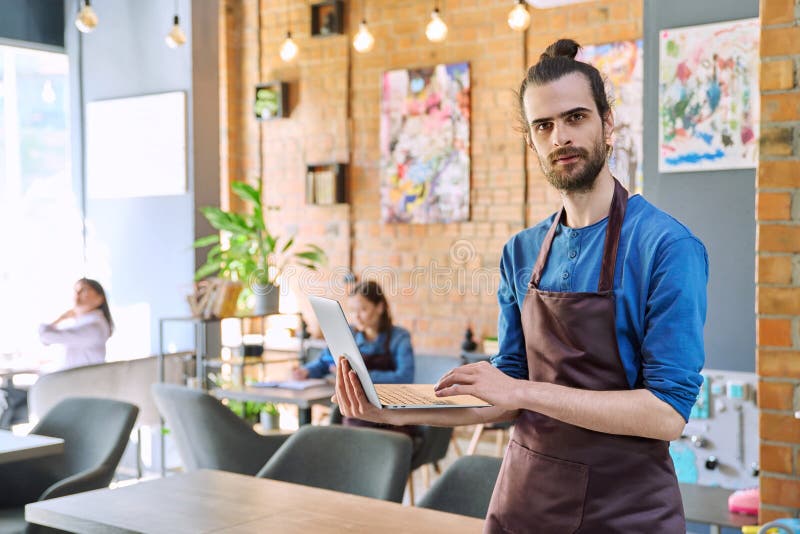 Man Service Worker Owner in Apron Using Laptop in Restaurant Cafeteria ...