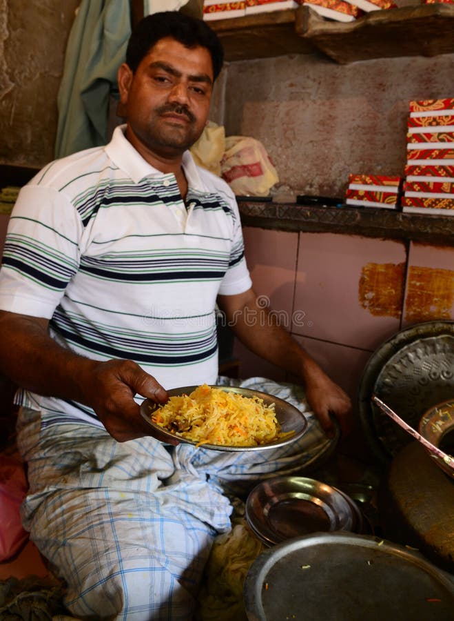 Man serving biryani editorial photo. Image of lucknow - 71534366