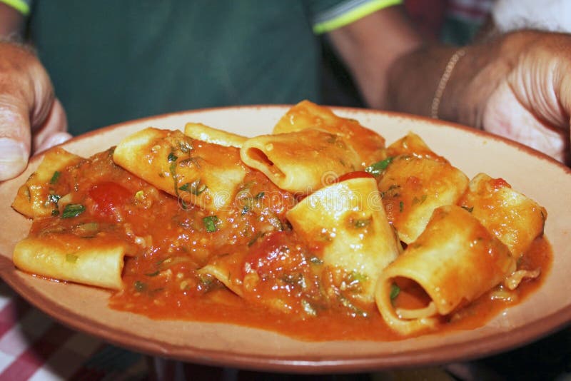 Man Serving a Dish of Pasta at the Table. Stock Image - Image of ...