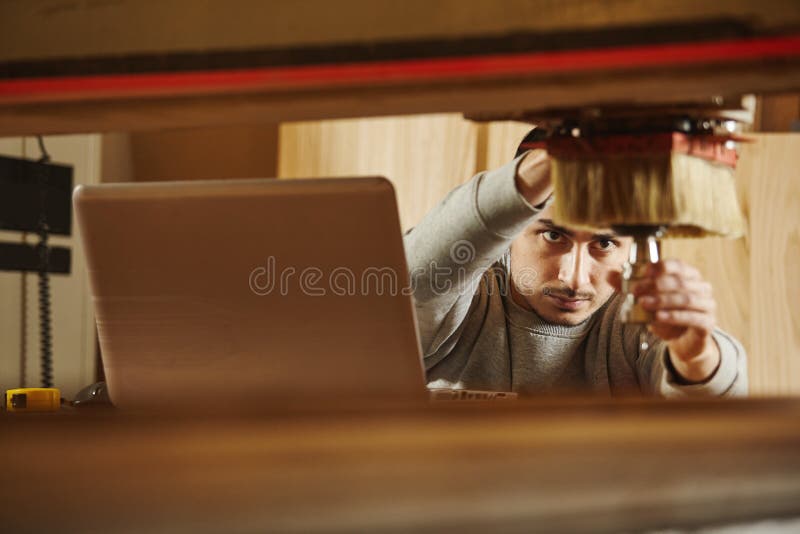 Man Sets the Cutter in Chuck for Cutting Wood. Machine with Computer ...