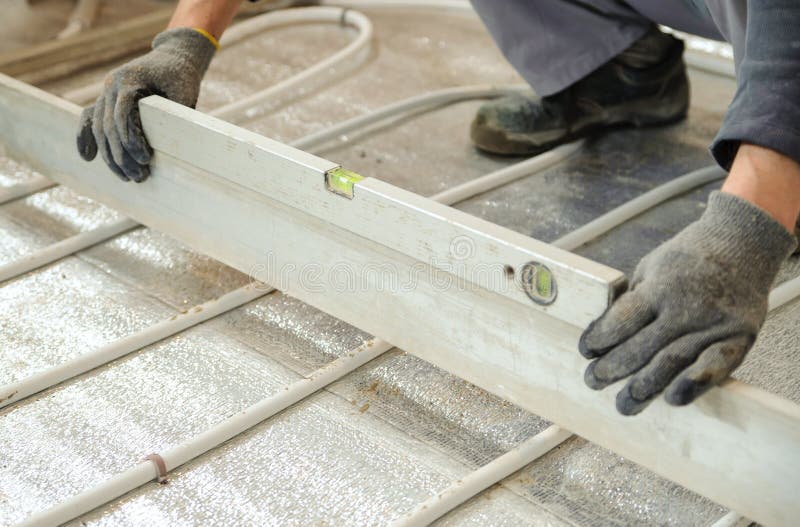Man Sets Level Concrete Floor Stock Photo - Image of pipe, tool: 52474530