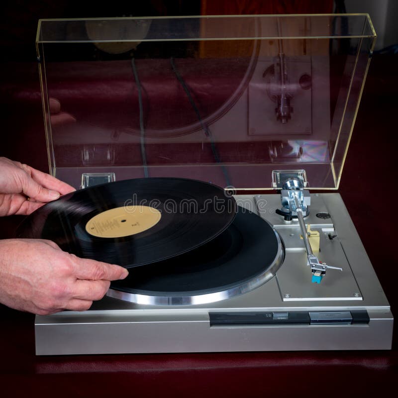 Man Sets a LP Record on a Player To Listen To Some Music Stock Image ...